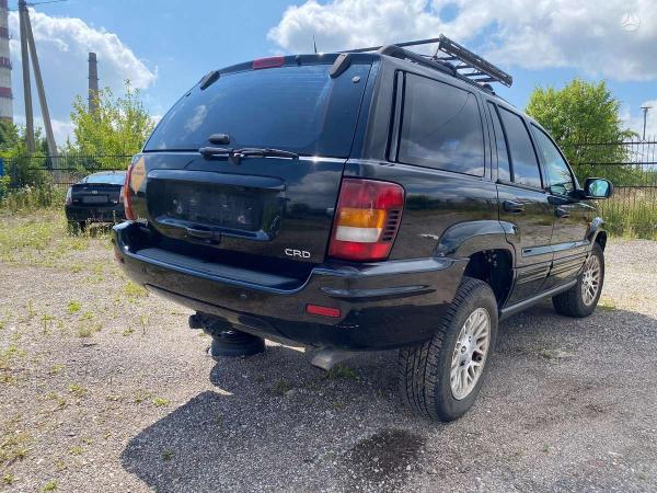 Black Jeep Grand Cherokee 2002 in Panevezys, with an engine capacity of 2.69 L and mileage of 236 thousand km for 3100 €, photo 3 on AUTOMOTO.COM.LV