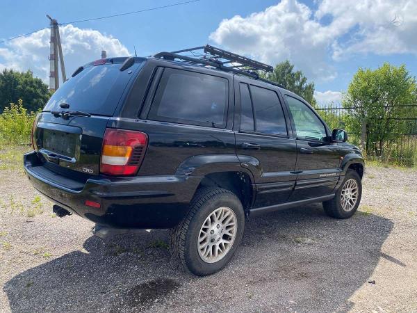 Black Jeep Grand Cherokee 2002 in Panevezys, with an engine capacity of 2.69 L and mileage of 236 thousand km for 3100 €, photo 5 on AUTOMOTO.COM.LV