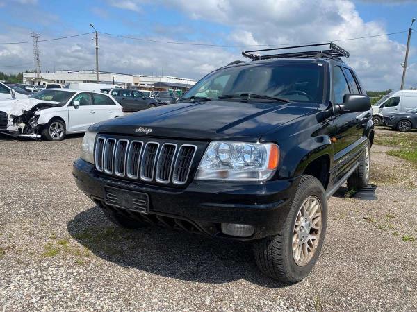 Black Jeep Grand Cherokee 2002 in Panevezys, with an engine capacity of 2.69 L and mileage of 236 thousand km for 3100 €, photo 8 on AUTOMOTO.COM.LV