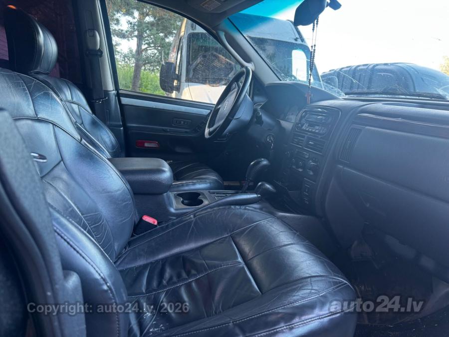 Melns Jeep Grand Cherokee 2002 Tallina, ar dzinēja tilpumu 2.70 L un nobraukumu 399 tūkst. km par 4100 €, foto 8 vietnē AUTOMOTO.COM.LV