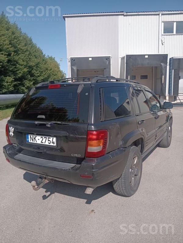 Melns Jeep Grand Cherokee 2003 Rīga, ar dzinēja tilpumu 2.70 L un nobraukumu 295 tūkst. km par 4200 €, foto 2 vietnē AUTOMOTO.COM.LV
