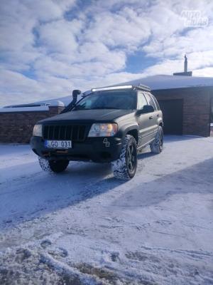 Melns Jeep Grand Cherokee 2004 Jonava, ar dzinēja tilpumu 2.70 L un nobraukumu 312 tūkst. km par 5500 €, foto  vietnē AUTOMOTO.COM.LV