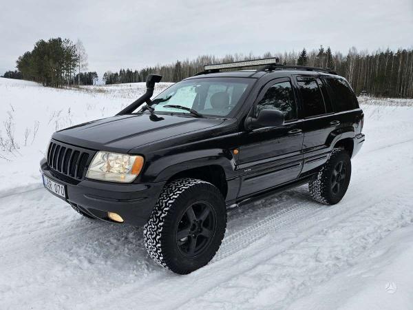 Black Jeep Grand Cherokee 2004 in Vilnius, with an engine capacity of 2.70 L and mileage of 196 thousand km for 6200 €, photo 1 on AUTOMOTO.COM.LV