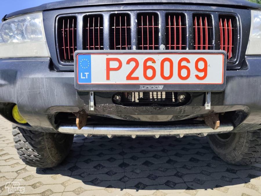 Black Jeep Grand Cherokee 2004 in Moletai, with an engine capacity of 2.70 L and mileage of 400 thousand km for 3100 €, photo 12 on AUTOMOTO.COM.LV