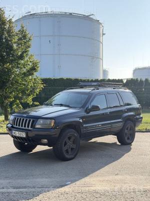 Melns Jeep Grand Cherokee 2004 Rīga, ar dzinēja tilpumu 2.70 L un nobraukumu 318 tūkst. km par 5800 €, foto  vietnē AUTOMOTO.COM.LV
