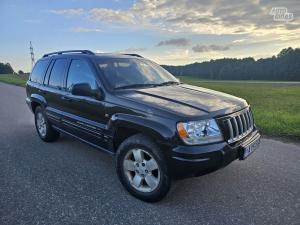 Black Jeep Grand Cherokee 2004 in Vilnius, with an engine capacity of 4.00 L and mileage of 207 thousand km for 2550 €, photo 3 on AUTOMOTO.COM.LV