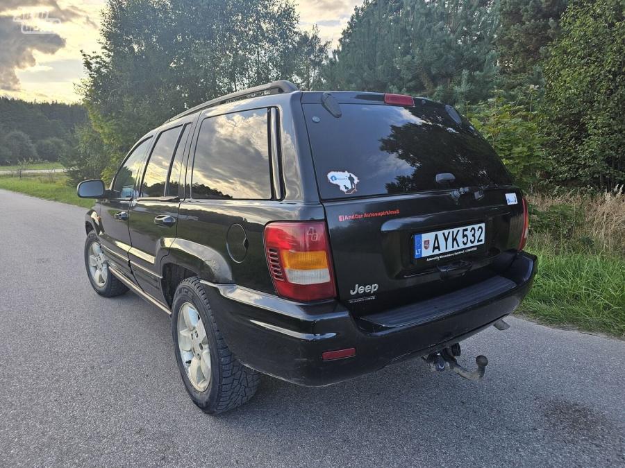 Black Jeep Grand Cherokee 2004 in Vilnius, with an engine capacity of 4.00 L and mileage of 207 thousand km for 2550 €, photo 4 on AUTOMOTO.COM.LV