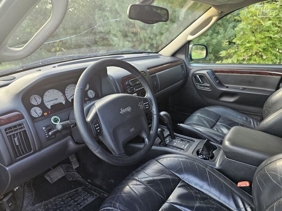 Black Jeep Grand Cherokee 2004 in Vilnius, with an engine capacity of 4.00 L and mileage of 207 thousand km for 2550 €, photo 9 on AUTOMOTO.COM.LV