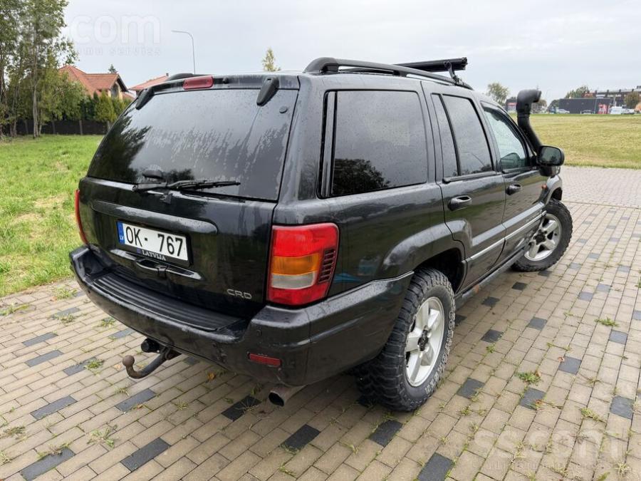 Black Jeep Grand Cherokee 2004 in Riga, with an engine capacity of 2.70 L and mileage of 315 thousand km for 3700 €, photo 6 on AUTOMOTO.COM.LV