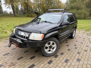 Black Jeep Grand Cherokee 2004 in Riga, with an engine capacity of 2.70 L and mileage of 315 thousand km for 3700 €, photo 13 on AUTOMOTO.COM.LV