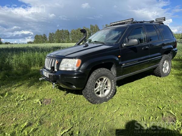 Melns Jeep Grand Cherokee 2005 Rīga, ar dzinēja tilpumu 2.70 L un nobraukumu 323 tūkst. km par 3900 €, foto 2 vietnē AUTOMOTO.COM.LV