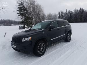 Black Jeep Grand Cherokee 2012 in Plunge, with an engine capacity of 5.70 L and mileage of 215 thousand km for 8500 €, photo  on AUTOMOTO.COM.LV