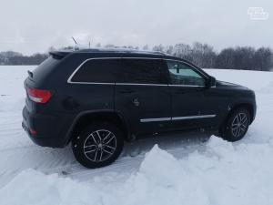 Black Jeep Grand Cherokee 2012 in Plunge, with an engine capacity of 5.70 L and mileage of 215 thousand km for 8500 €, photo 5 on AUTOMOTO.COM.LV