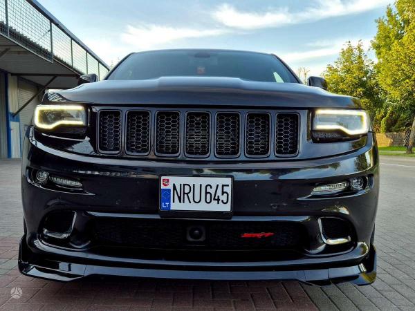 Black Jeep Grand Cherokee 2012 in Silute, with an engine capacity of 6.40 L and mileage of 240 thousand km for 16500 €, photo 7 on AUTOMOTO.COM.LV