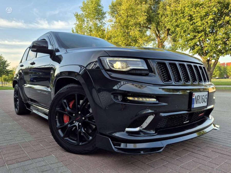 Black Jeep Grand Cherokee 2012 in Silute, with an engine capacity of 6.40 L and mileage of 245 thousand km for 15999 €, photo 1 on AUTOMOTO.COM.LV