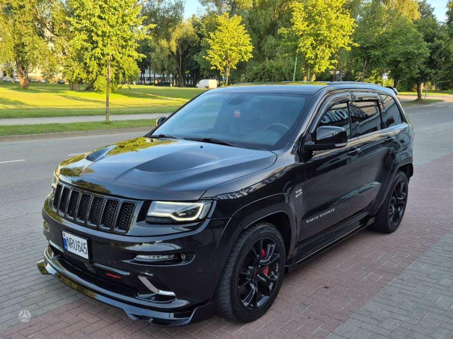 Black Jeep Grand Cherokee 2012 in Silute, with an engine capacity of 6.40 L and mileage of 245 thousand km for 15999 €, photo 5 on AUTOMOTO.COM.LV