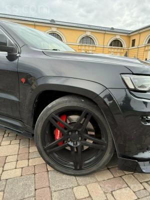 Black Jeep Grand Cherokee 2013 in Daugavpils, with an engine capacity of 6.40 L and mileage of 235 thousand km for 26500 €, photo 8 on AUTOMOTO.COM.LV
