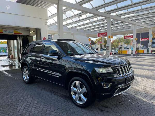 Black Jeep Grand Cherokee 2014 in Kaunas, with an engine capacity of 3.00 L and mileage of 168 thousand km for 13200 €, photo 6 on AUTOMOTO.COM.LV
