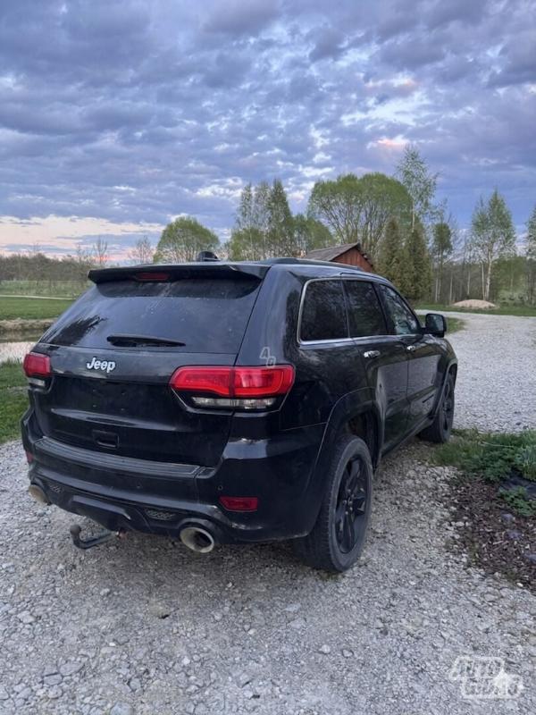 Black Jeep Grand Cherokee 2014 in Vilnius, with an engine capacity of 5.70 L and mileage of 293 thousand km for 11299 €, photo 1 on AUTOMOTO.COM.LV