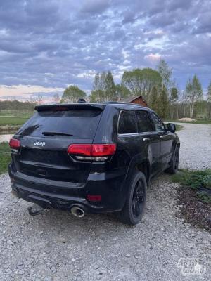 Black Jeep Grand Cherokee 2014 in Vilnius, with an engine capacity of 5.70 L and mileage of 293 thousand km for 11299 €, photo  on AUTOMOTO.COM.LV
