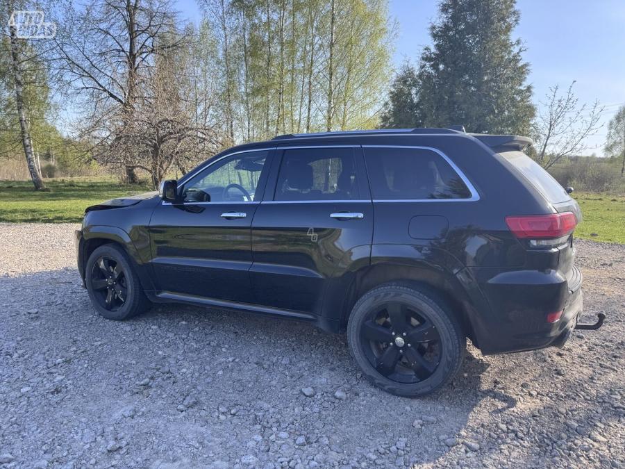 Black Jeep Grand Cherokee 2014 in Vilnius, with an engine capacity of 5.70 L and mileage of 293 thousand km for 11299 €, photo 4 on AUTOMOTO.COM.LV