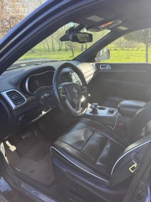 Black Jeep Grand Cherokee 2014 in Vilnius, with an engine capacity of 5.70 L and mileage of 293 thousand km for 11299 €, photo 10 on AUTOMOTO.COM.LV