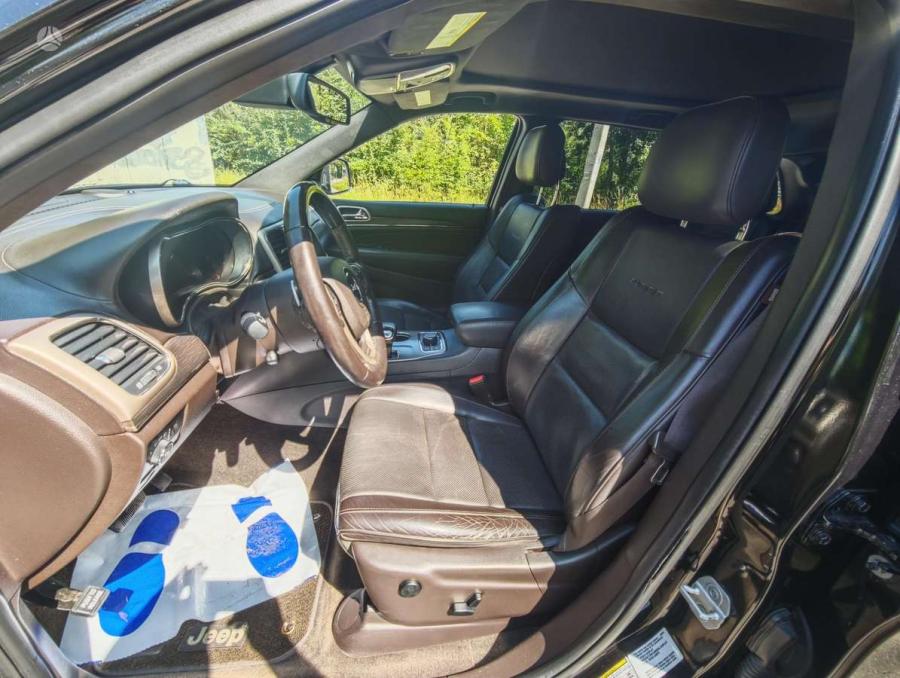 Black Jeep Grand Cherokee 2014 in Kaunas, with an engine capacity of 5.65 L and mileage of 238 thousand km for 13500 €, photo 13 on AUTOMOTO.COM.LV