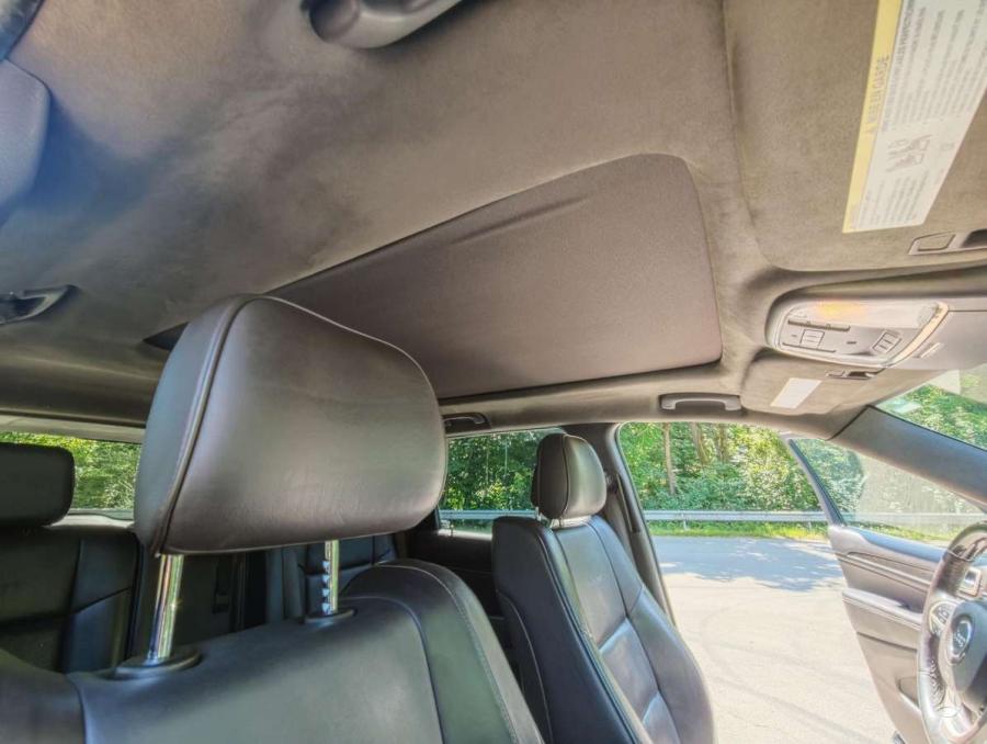 Black Jeep Grand Cherokee 2014 in Kaunas, with an engine capacity of 5.65 L and mileage of 238 thousand km for 13500 €, photo 21 on AUTOMOTO.COM.LV