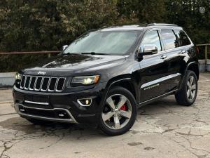 Black Jeep Grand Cherokee 2014 in Vilnius, with an engine capacity of 5.65 L and mileage of 257 thousand km for 16500 €, photo  on AUTOMOTO.COM.LV