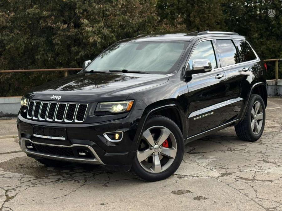 Black Jeep Grand Cherokee 2014 in Vilnius, with an engine capacity of 5.65 L and mileage of 257 thousand km for 16500 €, photo 1 on AUTOMOTO.COM.LV