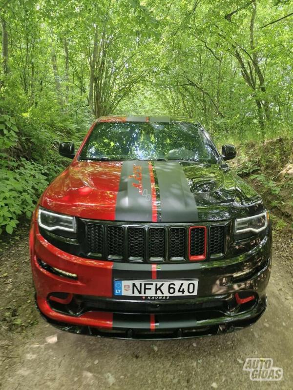 Black Jeep Grand Cherokee 2015 in Kaunas, with an engine capacity of 6.40 L and mileage of 170 thousand km for 24000 €, photo 1 on AUTOMOTO.COM.LV