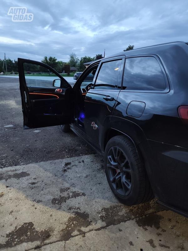 Black Jeep Grand Cherokee 2015 in Kaunas, with an engine capacity of 6.40 L and mileage of 170 thousand km for 24000 €, photo 6 on AUTOMOTO.COM.LV