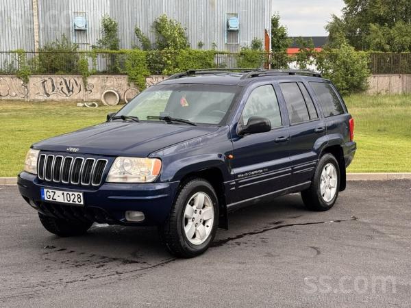 Zils Jeep Grand Cherokee 2002 Liepāja, ar dzinēja tilpumu 4.70 L un nobraukumu 287 tūkst. km par 2800 €, foto 1 vietnē AUTOMOTO.COM.LV