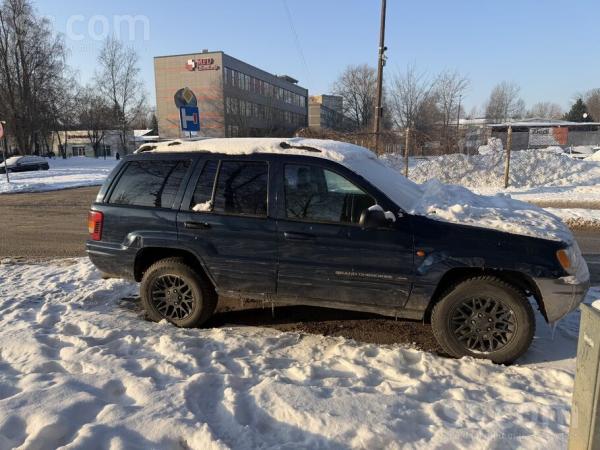 Blue Jeep Grand Cherokee 2003 in Riga, with an engine capacity of 2.70 L and mileage of 257 thousand km for 2700 €, photo 7 on AUTOMOTO.COM.LV