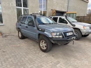 Zils Jeep Grand Cherokee 2003 Rēzekne, ar dzinēja tilpumu 2.70 L un nobraukumu 347 tūkst. km par 5600 €, foto  vietnē AUTOMOTO.COM.LV