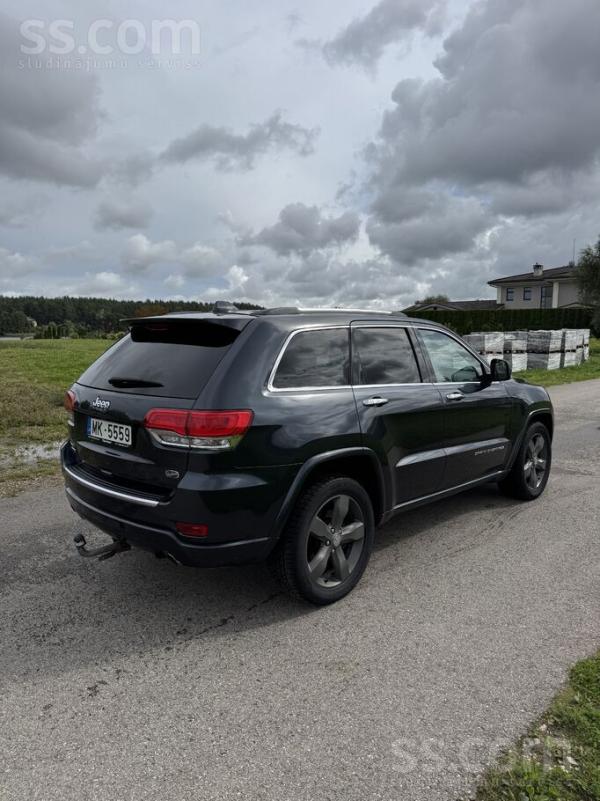 Blue Jeep Grand Cherokee 2014 in Riga, with an engine capacity of 3.00 L and mileage of 259 thousand km for 11800 €, photo 5 on AUTOMOTO.COM.LV