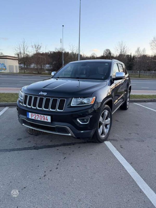 Blue Jeep Grand Cherokee 2015 in Vilnius, with an engine capacity of 5.65 L and mileage of 255 thousand km for 13000 €, photo 1 on AUTOMOTO.COM.LV