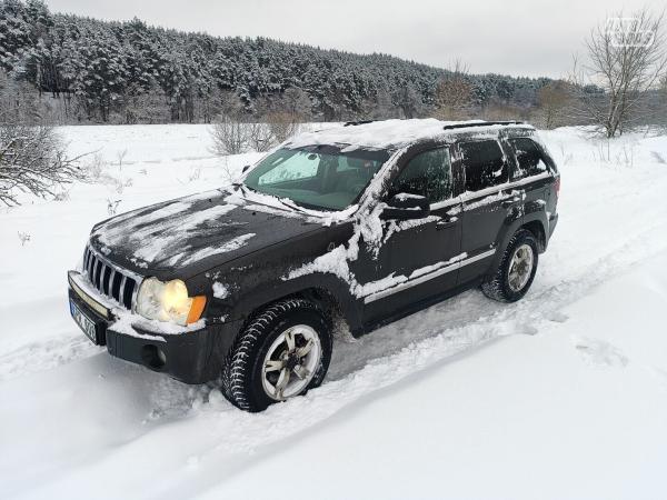 Brown Jeep Grand Cherokee 2007 in Vilnius, with an engine capacity of 5.70 L and mileage of 290 thousand km for 4400 €, photo 1 on AUTOMOTO.COM.LV