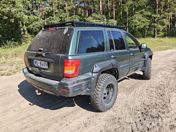 Green Jeep Grand Cherokee 1999 in Riga, with an engine capacity of 4.00 L and mileage of 310 thousand km for 3000 €, photo 3 on AUTOMOTO.COM.LV