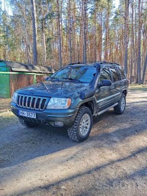Zaļš Jeep Grand Cherokee 2002 Rīga, ar dzinēja tilpumu 4.70 L un nobraukumu 209 tūkst. km par 3700 €, foto  vietnē AUTOMOTO.COM.LV