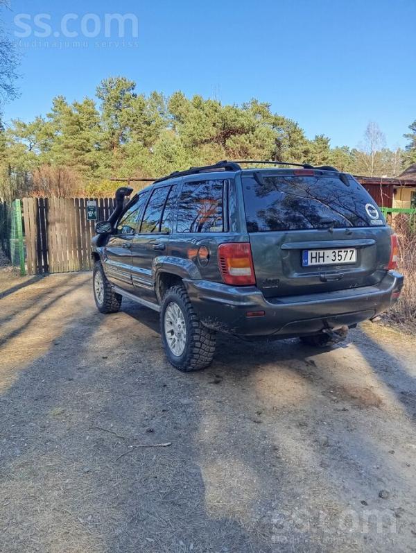 Zaļš Jeep Grand Cherokee 2002 Rīga, ar dzinēja tilpumu 4.70 L un nobraukumu 209 tūkst. km par 3700 €, foto 2 vietnē AUTOMOTO.COM.LV