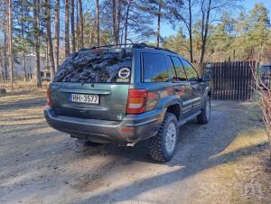 Zaļš Jeep Grand Cherokee 2002 Rīga, ar dzinēja tilpumu 4.70 L un nobraukumu 209 tūkst. km par 3700 €, foto 4 vietnē AUTOMOTO.COM.LV