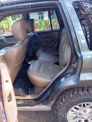 Zaļš Jeep Grand Cherokee 2002 Rīga, ar dzinēja tilpumu 4.70 L un nobraukumu 209 tūkst. km par 3700 €, foto 8 vietnē AUTOMOTO.COM.LV
