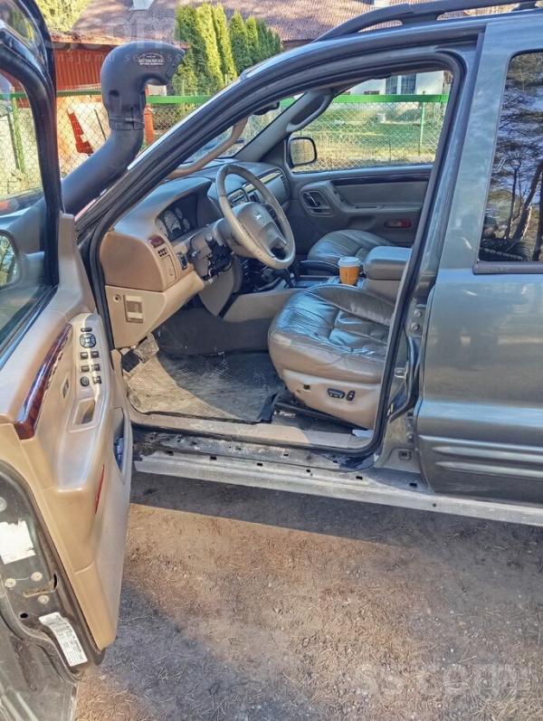 Zaļš Jeep Grand Cherokee 2002 Rīga, ar dzinēja tilpumu 4.70 L un nobraukumu 209 tūkst. km par 3700 €, foto 9 vietnē AUTOMOTO.COM.LV