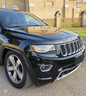 Green Jeep Grand Cherokee 2014 in Elektrenai, with an engine capacity of 3.60 L and mileage of 126 thousand km for 8800 €, photo 7 on AUTOMOTO.COM.LV