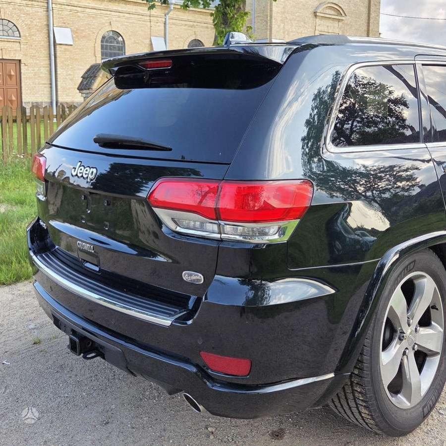Green Jeep Grand Cherokee 2014 in Elektrenai, with an engine capacity of 3.60 L and mileage of 126 thousand km for 8800 €, photo 11 on AUTOMOTO.COM.LV
