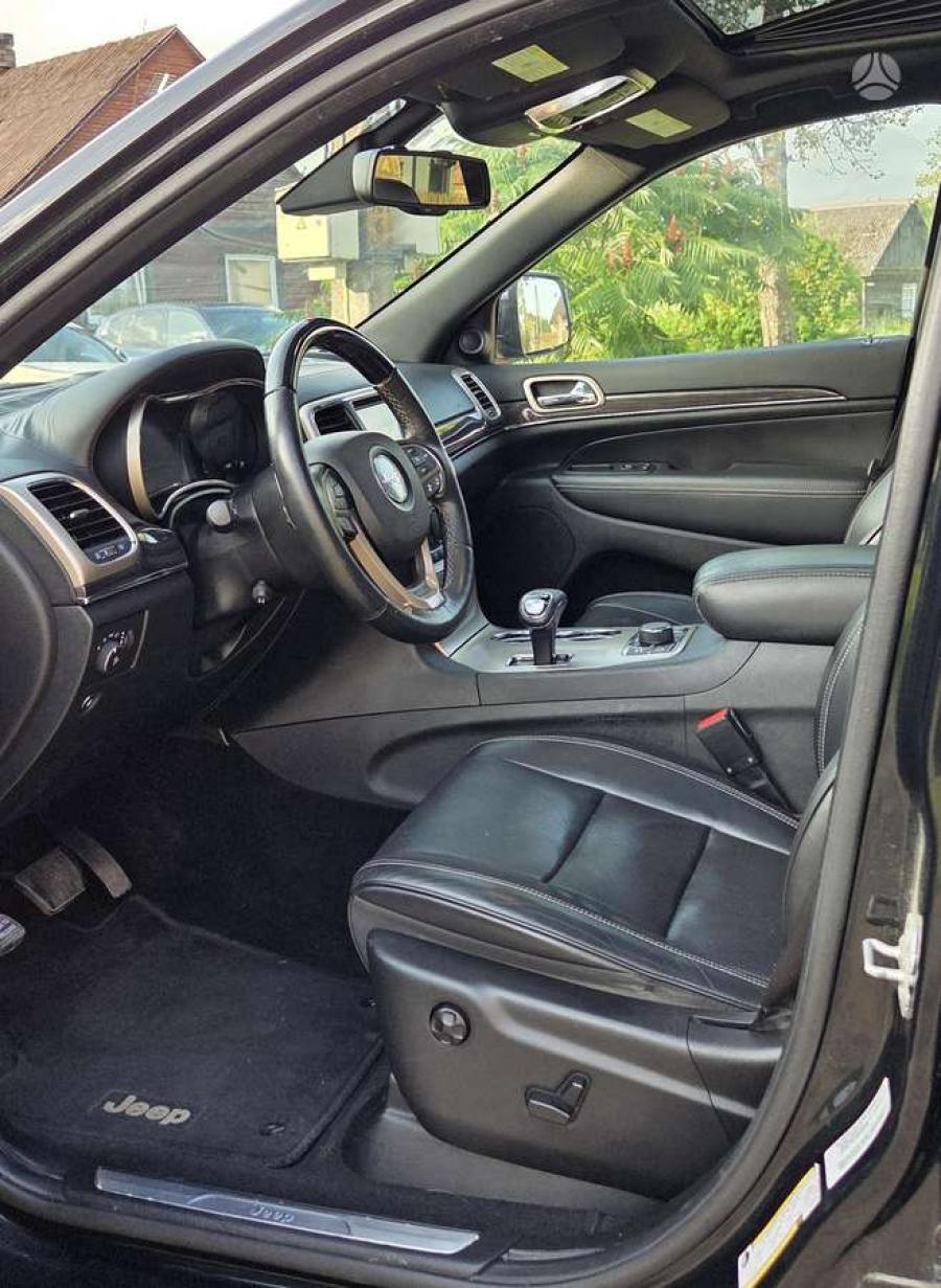 Green Jeep Grand Cherokee 2014 in Elektrenai, with an engine capacity of 3.60 L and mileage of 126 thousand km for 8800 €, photo 22 on AUTOMOTO.COM.LV
