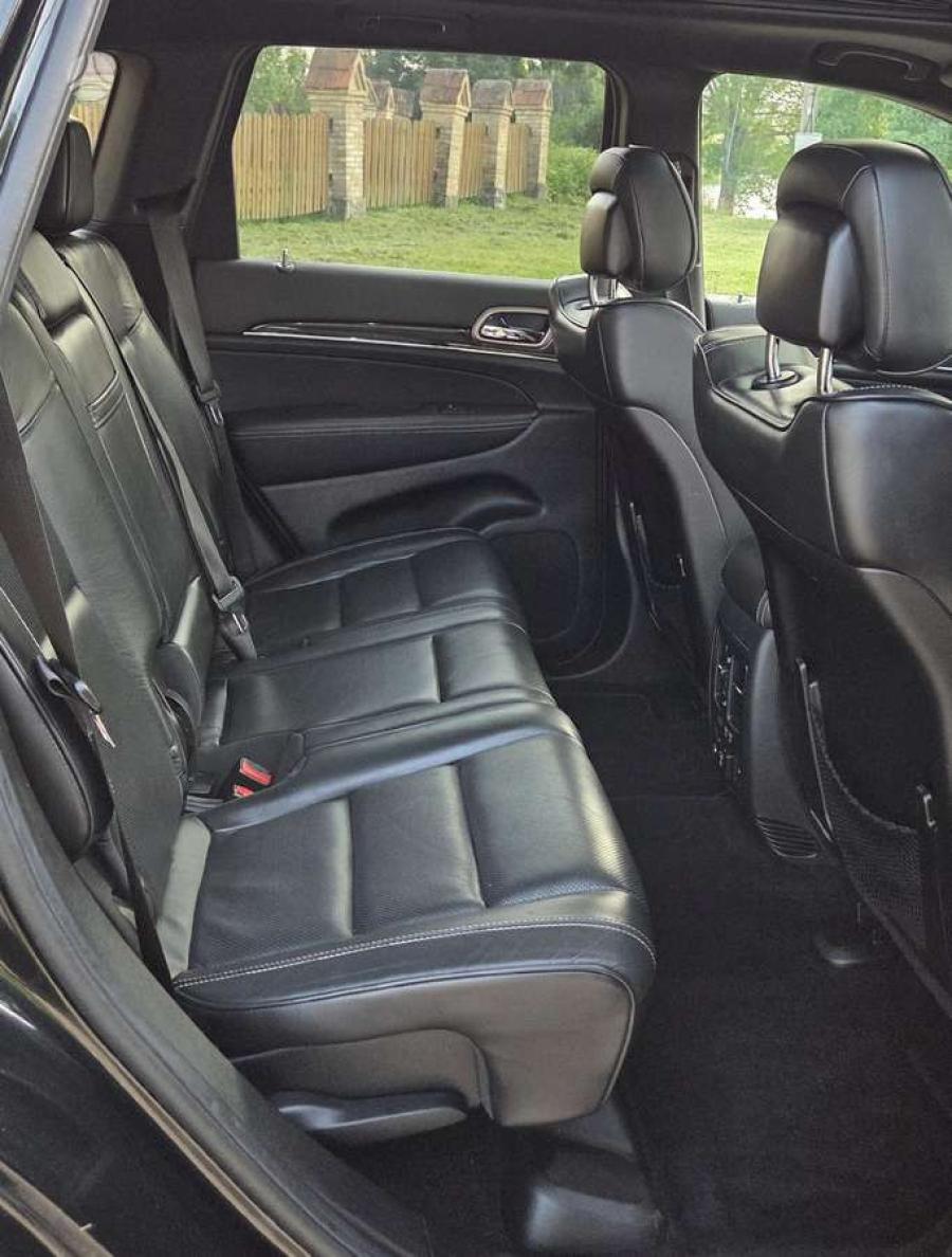 Green Jeep Grand Cherokee 2014 in Elektrenai, with an engine capacity of 3.60 L and mileage of 126 thousand km for 8800 €, photo 26 on AUTOMOTO.COM.LV