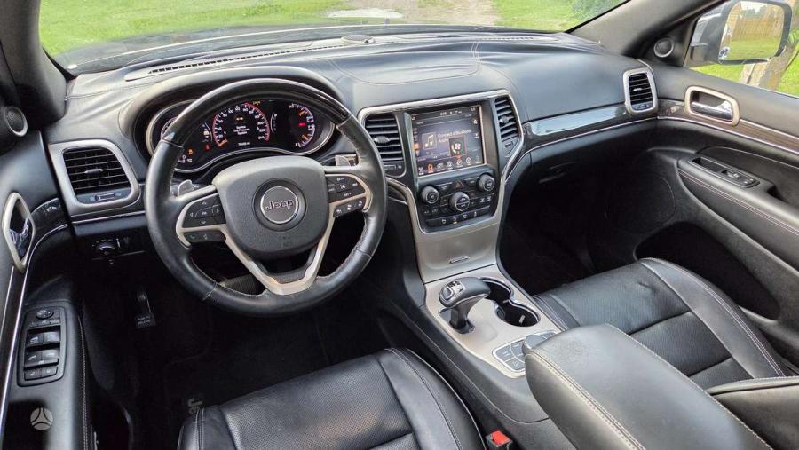 Green Jeep Grand Cherokee 2014 in Elektrenai, with an engine capacity of 3.60 L and mileage of 126 thousand km for 8800 €, photo 28 on AUTOMOTO.COM.LV