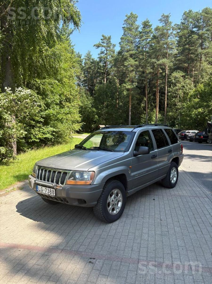 Pelēks Jeep Grand Cherokee 2000 Rīga, ar dzinēja tilpumu 4.70 L un nobraukumu 197 tūkst. km par 4300 €, foto 1 vietnē AUTOMOTO.COM.LV